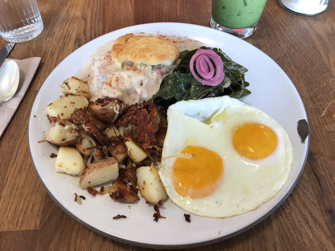 Two sunny-side eggs stare back at you like optimistic eyes saying, "Your day is about to get significantly better." Those potatoes didn't come from a freezer bag, folks.