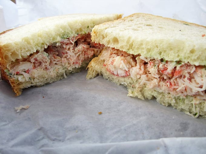 The legendary crab sandwich in all its glory—chunks of sweet meat barely held together by just enough mayo, nestled between slices of fresh bread.