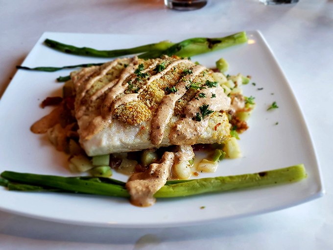 This isn't just fish—it's edible architecture. Delicate flounder embraces sweet crab stuffing in a dish that's both elegant and utterly comforting.