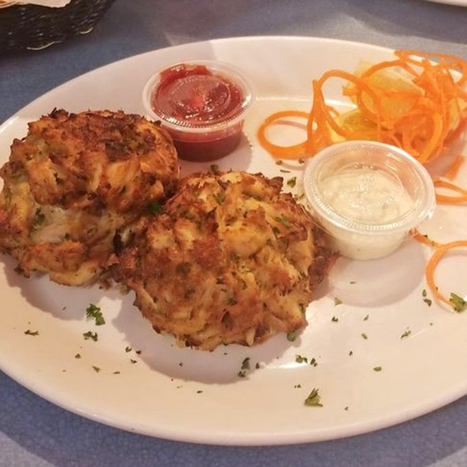 These crab cakes aren't just golden brown – they're Maryland's answer to the question "What would perfection taste like if it came with dipping sauce?"
