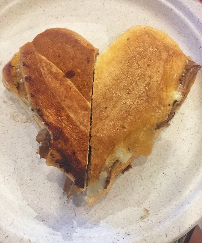 The Cuban sandwich arrives like a perfectly pressed postcard from Havana—crispy exterior giving way to a harmony of pork, ham, and pickles.