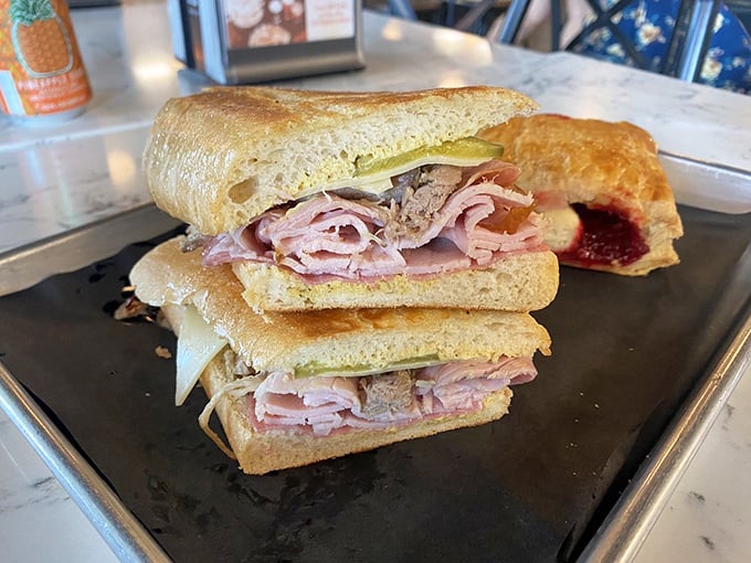 Behold the Cuban sandwich in its natural habitat—perfectly pressed, layered with precision, and waiting to change your definition of lunch.