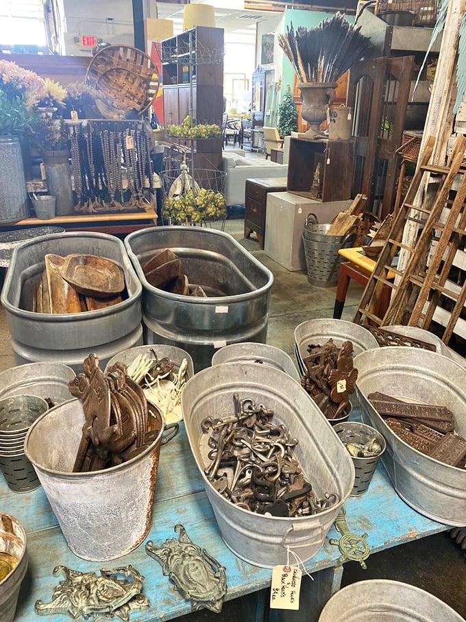 Galvanized glory! These metal tubs aren't just containers—they're vessels of possibility, each filled with rustic treasures waiting for new homes.