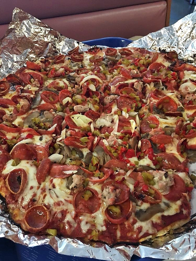 This isn't just pizza—it's a masterpiece of toppings. The pepperoni cups cradle tiny pools of flavor that'll make you weep with joy.