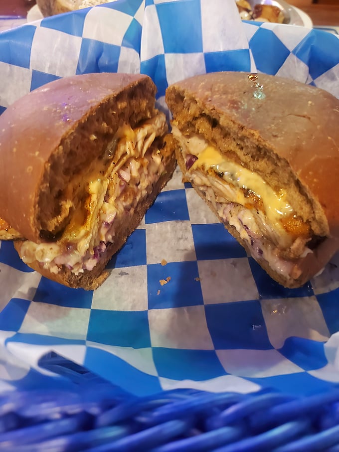 The legendary dolphin sandwich in all its glory—mahi-mahi nestled between bread with just enough toppings to complement, not overwhelm, the star attraction.