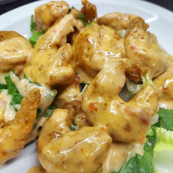These golden shrimp swimming in creamy sauce aren't just appetizers—they're little flavor bombs that make you question why you'd ever eat anything else.