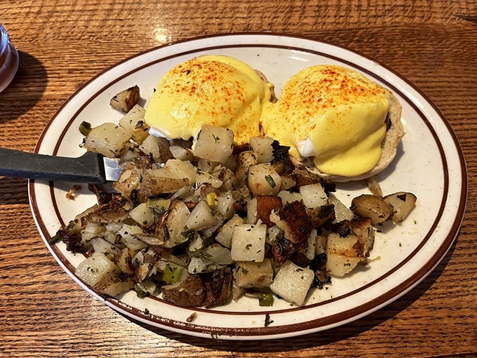 Eggs Benedict that would make a French chef weep with joy – those golden yolks just waiting to cascade over perfectly seasoned potatoes.