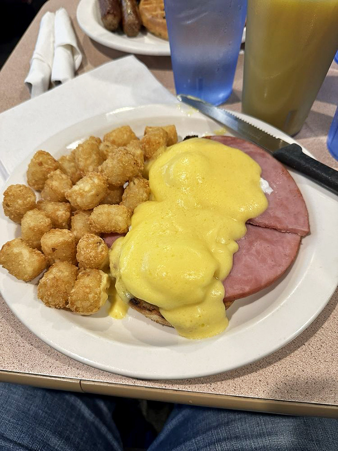 Eggs Benedict that would make a French chef weep with joy. That hollandaise sauce blankets the ham like a sunny morning embrace.