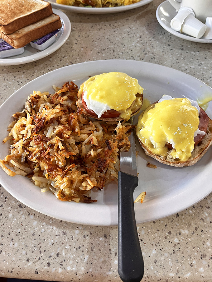 Eggs Benedict: where hollandaise dreams come true. Those crispy hash browns aren't just a side dish—they're the supporting actor who steals the show.