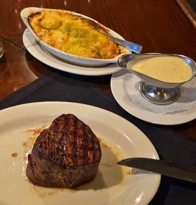 Behold the filet mignon in its natural habitat, accompanied by golden potatoes that know their supporting role perfectly. 