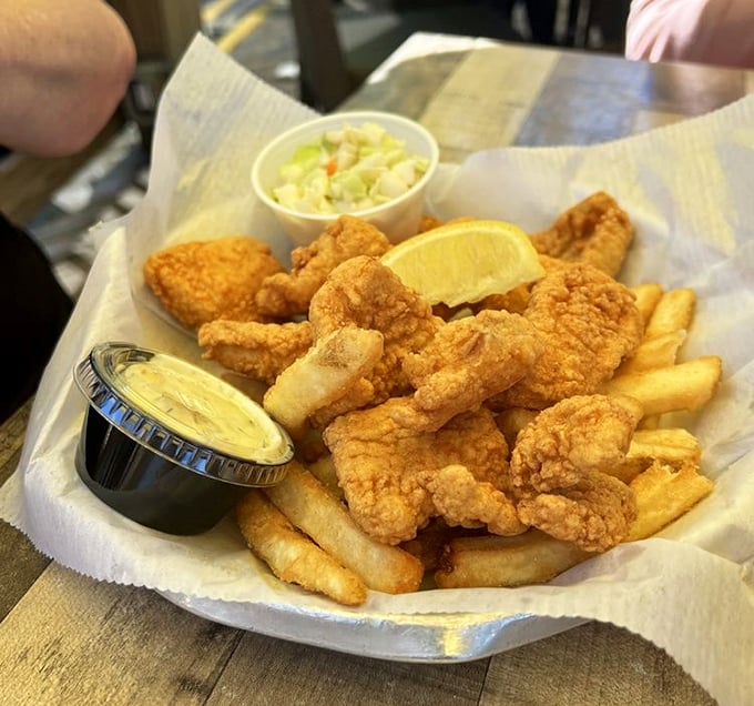 Golden-battered fish and crispy fries – the kind of fish and chips that makes you wonder why you'd ever order anything else.