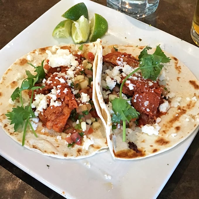 These aren't just fish tacos—they're edible love letters from the Pacific. Crispy rockfish, fresh cilantro, and that mysterious sauce that'll haunt your dreams for weeks.