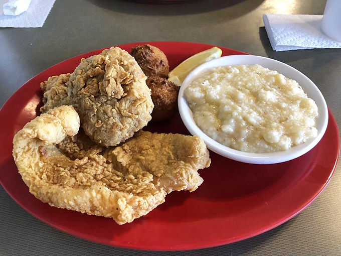 Golden-fried perfection meets creamy cheese grits. This plate doesn't need fancy garnishes—it lets the Gulf's bounty speak for itself. 