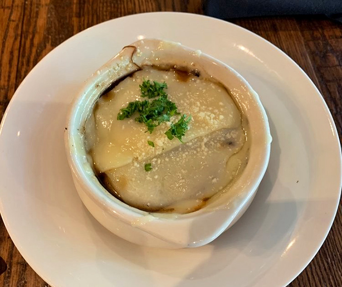 The legendary French onion soup in all its glory – that cheese cap is the edible equivalent of a warm hug on a cold Pennsylvania day. 