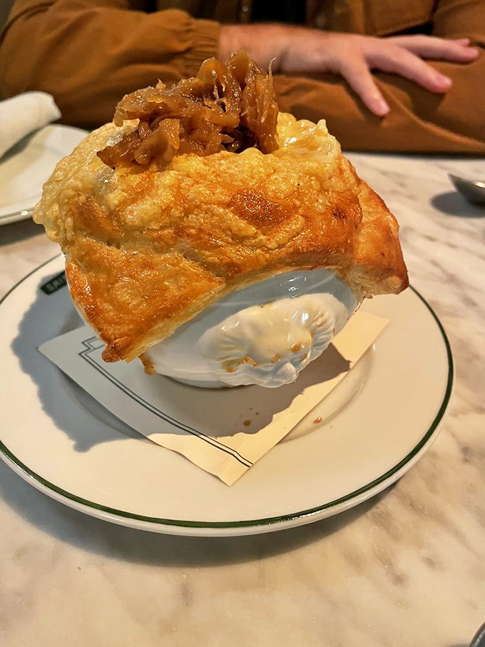 Not just soup, but a geological marvel—layers of caramelized onions, rich broth, and a cheese cap that stretches like a gymnast.