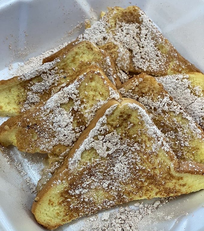 Golden-brown French toast dusted with powdered sugar—the breakfast equivalent of finding money in an old jacket pocket.