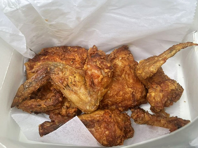 Golden-brown perfection in a box. This isn't just fried chicken—it's an edible masterpiece with a crunch you can hear across the room.