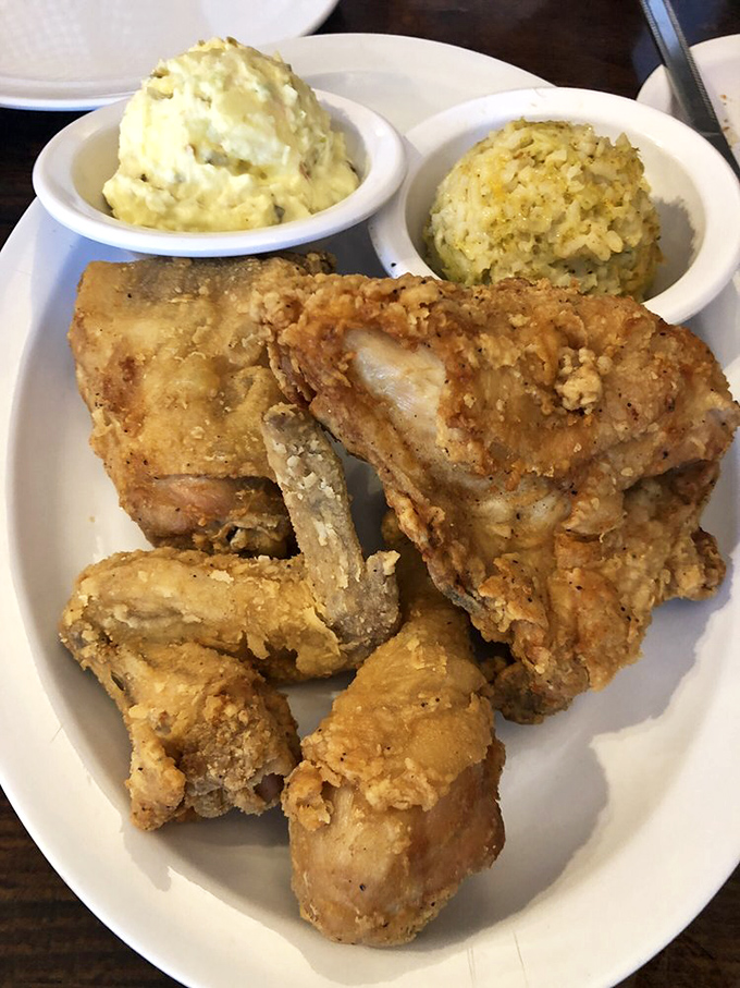 Golden-brown perfection that makes you understand why people line up around the block. This chicken isn't just fried – it's transformed.