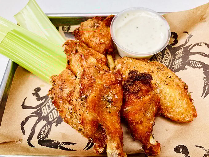Golden-brown chicken wings that could make a crab jealous. Crispy on the outside, juicy on the inside—the unexpected star of a seafood joint.