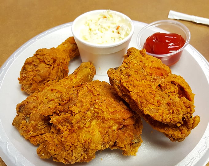 Golden armor of perfectly seasoned crust protecting juicy chicken underneath. This isn't just fried chicken—it's an edible work of art that speaks fluent Southern.