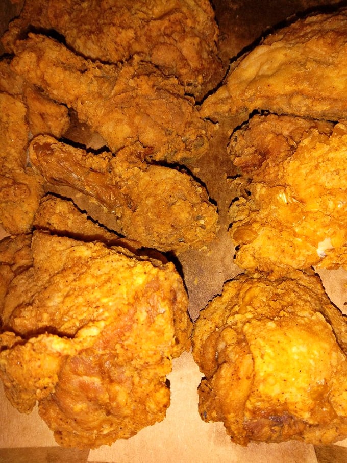 Golden-brown fried chicken that crackles with each bite – the kind that makes you wonder if your grandmother secretly moonlights in the kitchen.