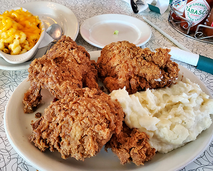 Golden perfection arrives crispy outside, juicy inside – this is what fried chicken was meant to be.