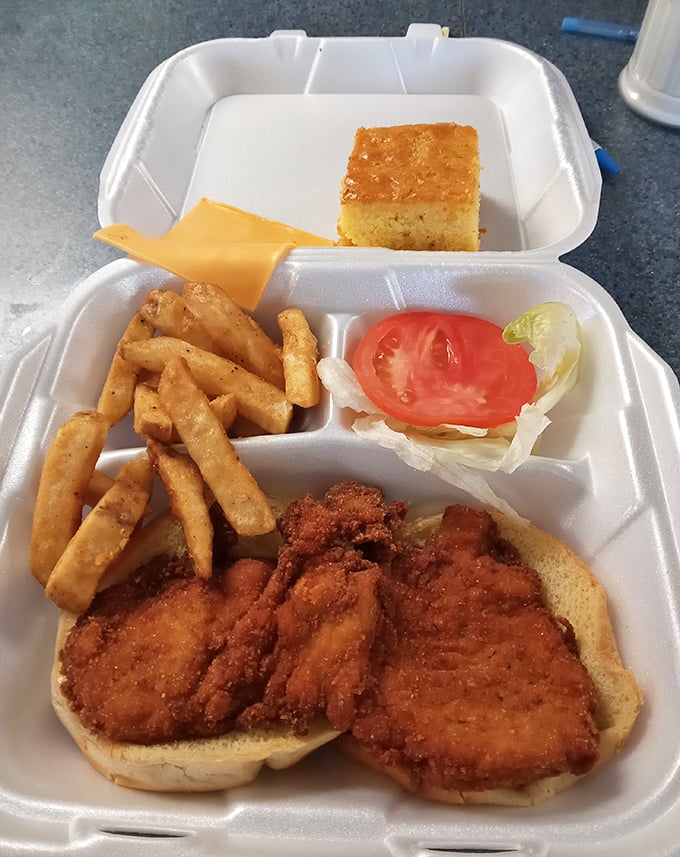 This isn't just a fried chicken sandwich—it's a masterclass in crunch. Golden-brown perfection nestled in a soft bun with crispy fries standing guard.