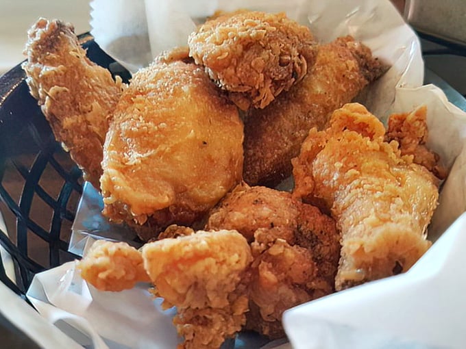 Golden-brown perfection in a basket. These chicken wings aren't just fried—they're transformed into crunchy, juicy morsels that haunt your dreams.