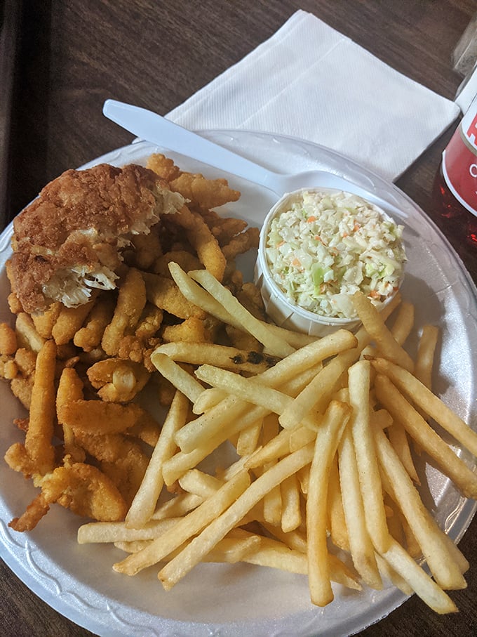 Golden-fried clams and crispy fries—the holy trinity of seafood shack perfection when paired with that creamy coleslaw. Worth every mile of the drive.