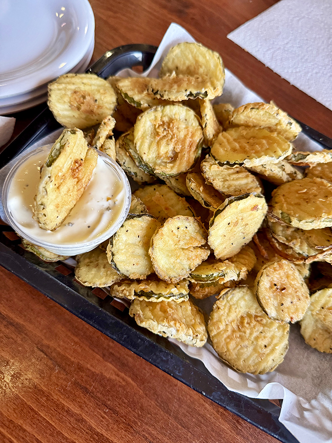 Fried pickles: The gateway appetizer that turns first-timers into regulars. Crispy, tangy discs of joy that disappear faster than your diet resolutions.