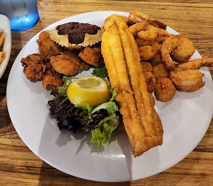 The seafood sampler that answers the eternal question: "Why choose one when you can have it all?" That crispy cornmeal coating is practically winking at you.