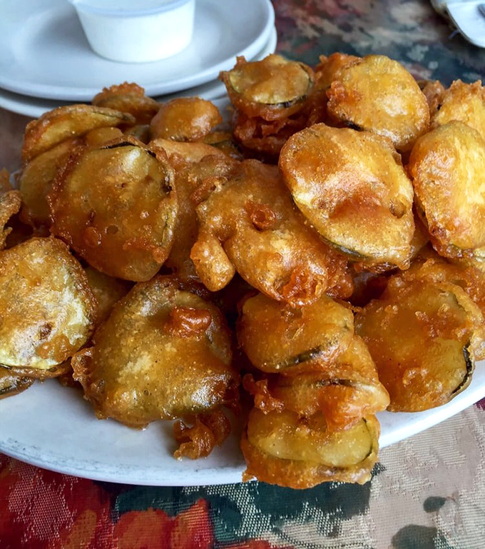 Golden-fried pickle chips that shatter with each bite, revealing tangy dill centers. These aren't just appetizers—they're conversation stoppers.