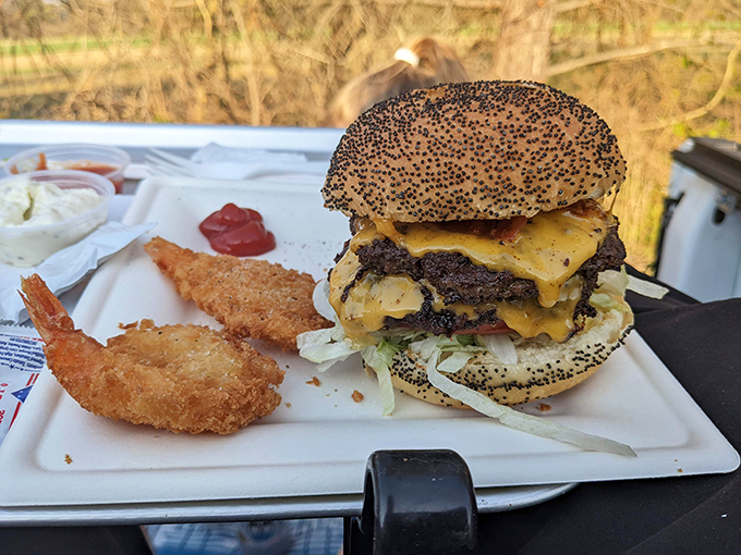 This isn't just a burger, it's architecture—a masterpiece of beef, cheese, and sesame seeds that demands both respect and napkins.