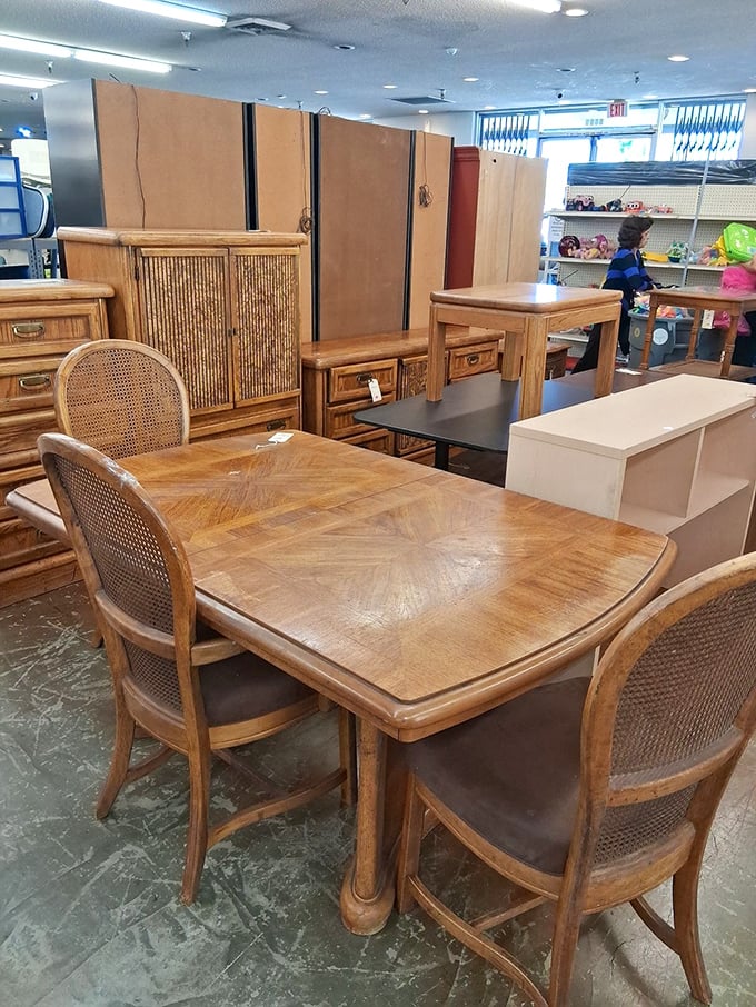 Mid-century dining sets with cane-back chairs whisper tales of family dinners past while waiting for their next chapter.
