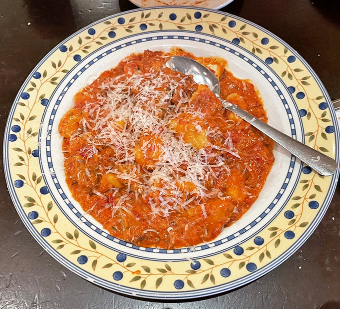 This gnocchi isn't just swimming in sauce—it's doing the backstroke in a pool of flavor that would make any nonna weep with joy.