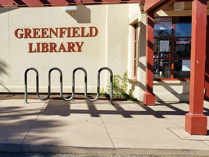 The Greenfield Library welcomes bibliophiles with its no-nonsense bike rack—park your Schwinn and swap your screen time for page-turning.