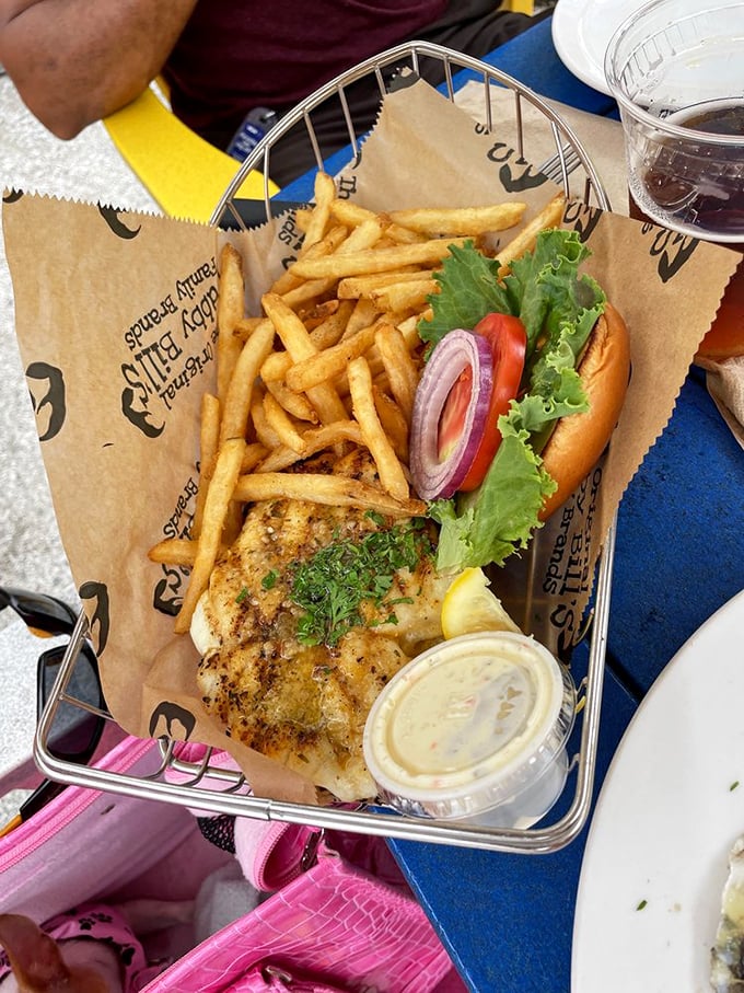 This blackened grouper sandwich isn't just lunch—it's Florida's maritime history served between two pieces of bread with a side of perfectly crisp fries.