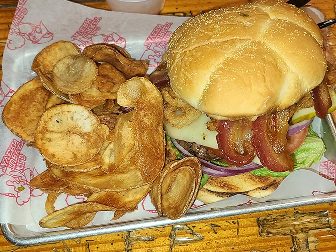 This isn't just a burger, it's a statement of purpose. Crispy homemade chips that shatter like dreams and a patty that demands respect.