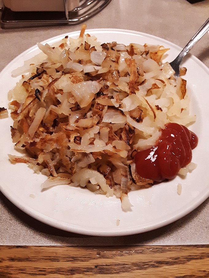 Behold the hash browns in their natural habitat—crispy, golden, and ready to make all your other potato experiences seem like mere practice rounds.