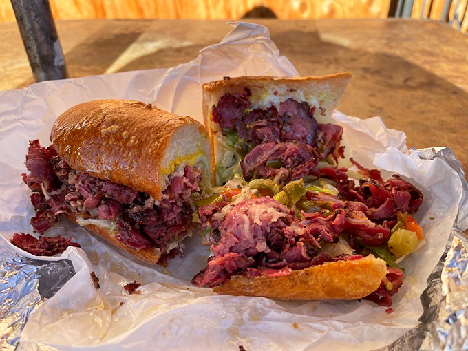 This hot pastrami isn't just a sandwich—it's a masterpiece of meat architecture that requires both hands and possibly a bib.