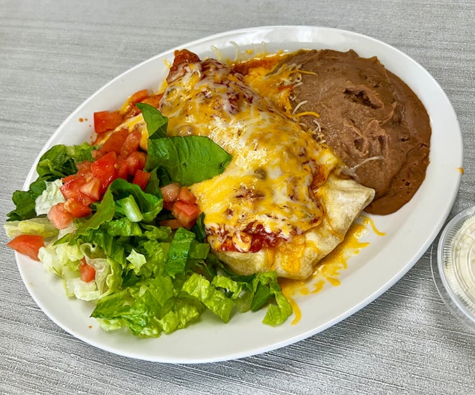 Huevos rancheros arrive as a colorful fiesta on a plate, complete with beans that taste like pure comfort.