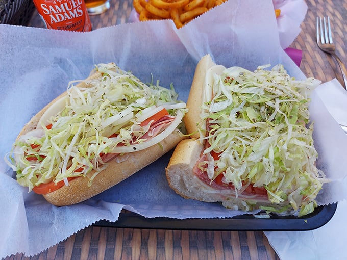 The Italian hoagie arrives like a work of art—a mountain range of shredded lettuce atop layers of meat and cheese that demands a jaw unhinge. 