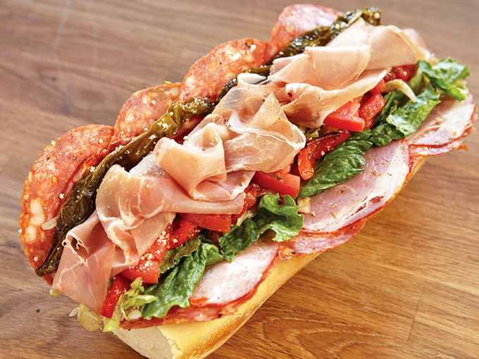 Layer upon layer of Italian meats, veggies, and provolone, all harmonizing like a Sinatra ballad. This isn't just a sandwich—it's an edible work of art.