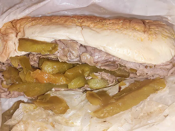 Behold the Italian beef in all its juicy glory! This sandwich isn't just a meal—it's a Chicago handshake, dripping with tradition and requiring that famous "Italian beef lean."