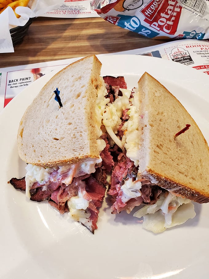 This isn't just a sandwich – it's a skyscraper of perfectly stacked corned beef, coleslaw and Russian dressing that requires both hands and a strategy.