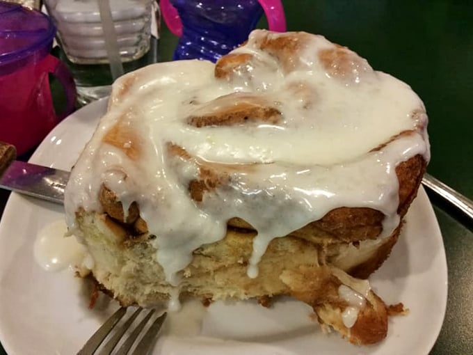Behold the magnificent cinnamon roll—so gloriously frosted it could qualify for its own ZIP code. This isn't breakfast; it's a religious experience.