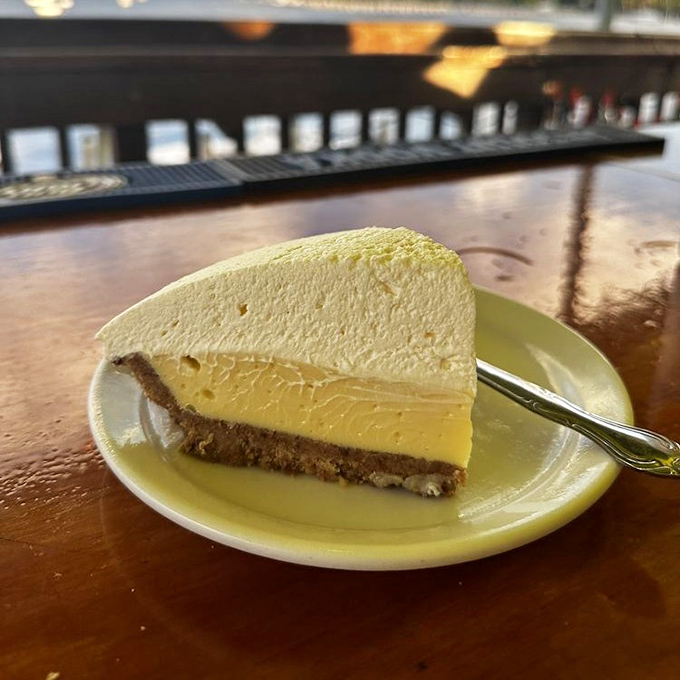 This key lime pie isn't just dessert—it's Florida sunshine on a plate. Perfectly balanced between tart and sweet, with a crust that deserves its own fan club.