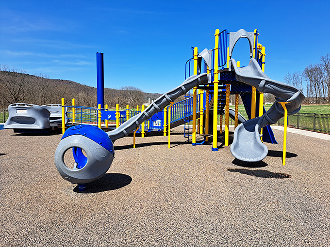 Modern playground equipment against the backdrop of Pennsylvania's rolling hills—where kids burn energy while parents soak in those mountain views.