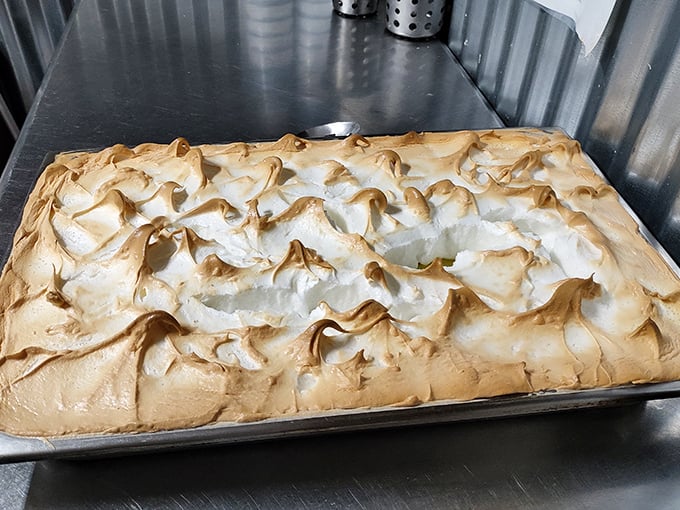 Behold the golden-peaked masterpiece! This meringue mountain isn't just dessert—it's architecture with a sweet disposition.
