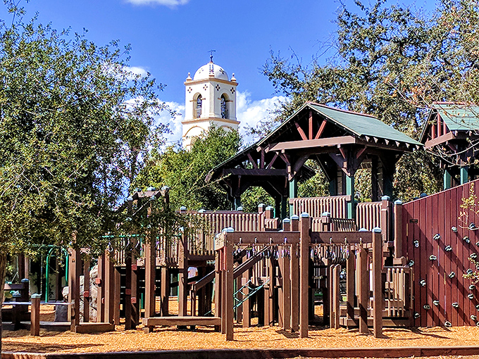 Libbey Park's playground offers pint-sized adventure with the town's signature bell tower keeping watch—childhood memories made under California blue skies.